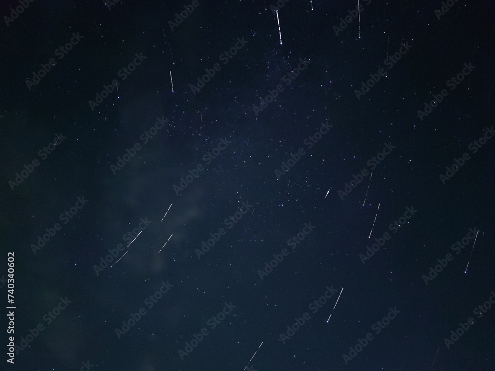 Starry night sky in village. A black-gray night sky in which white ...