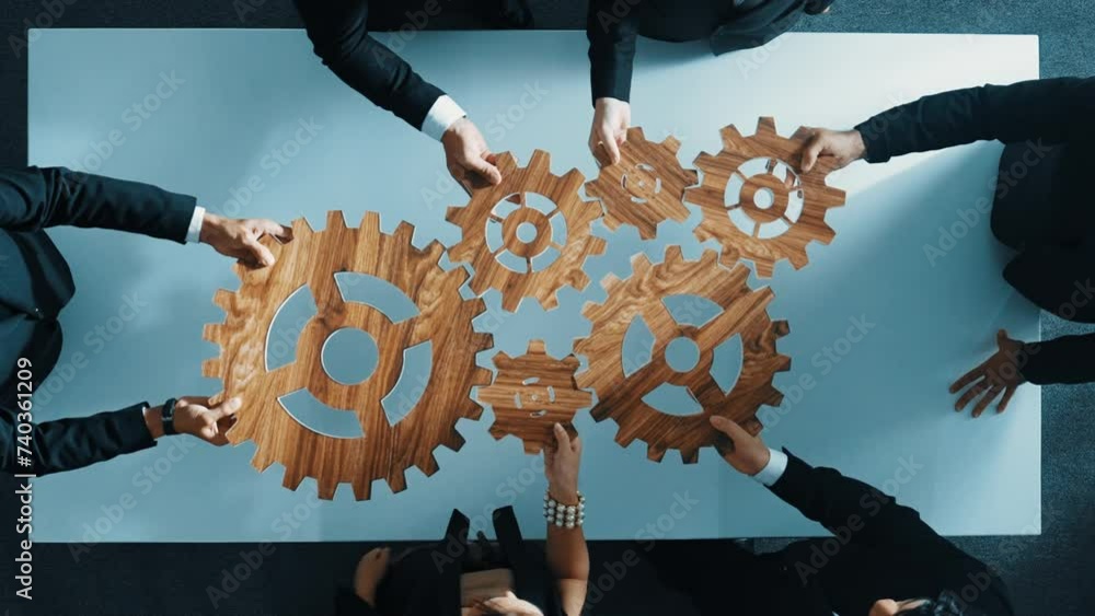 Top view of smart business people gather wooden cog together at meeting ...