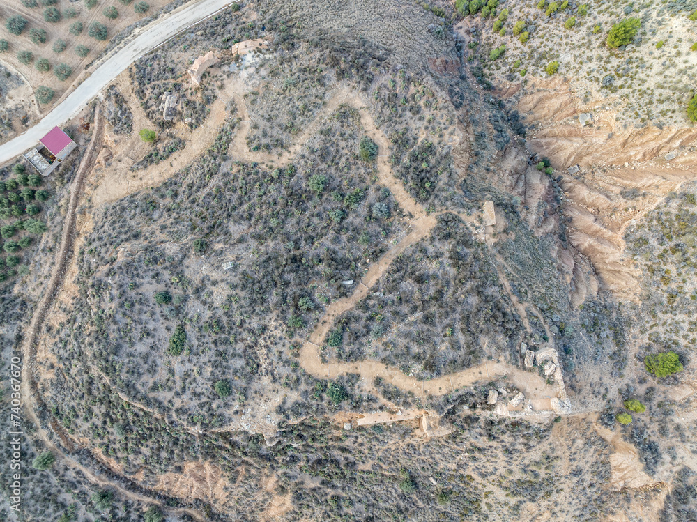 Aerial view of medieval Pliego castle partially restored curtain walls ...