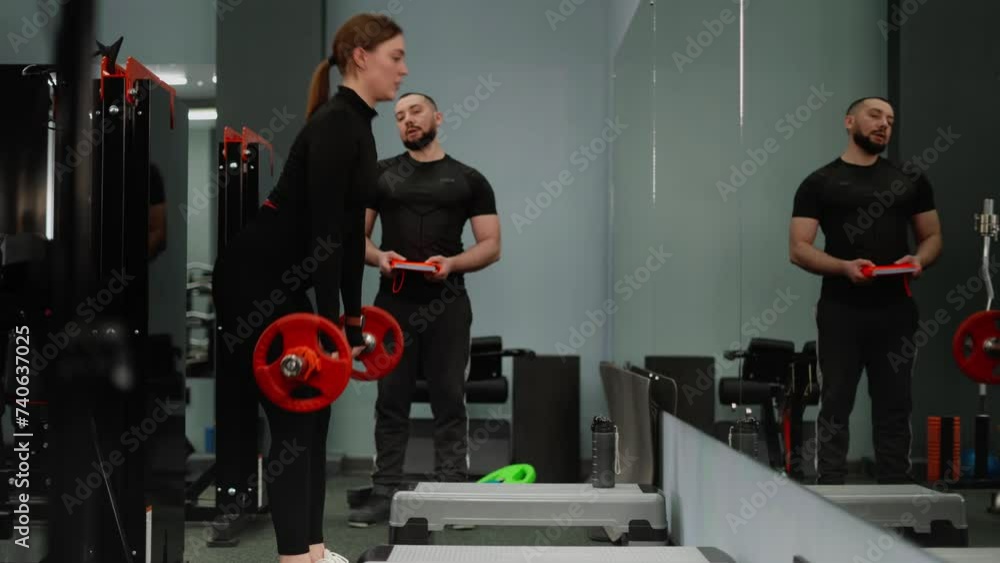 The trainer monitors and helps to perform the buttock reduction ...