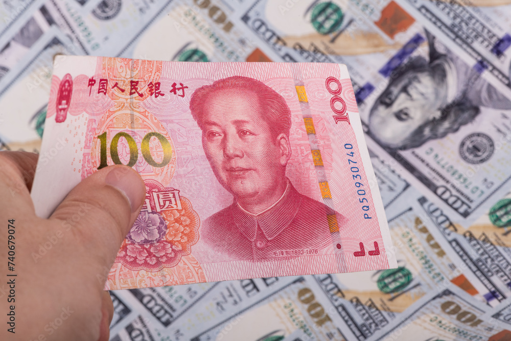 100 Chinese yuan note and 100 US dollar note Stock Photo | Adobe Stock