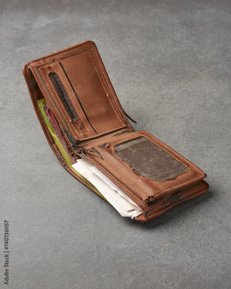 old worn out wallet with papers, receipts and cash inside, years of ...