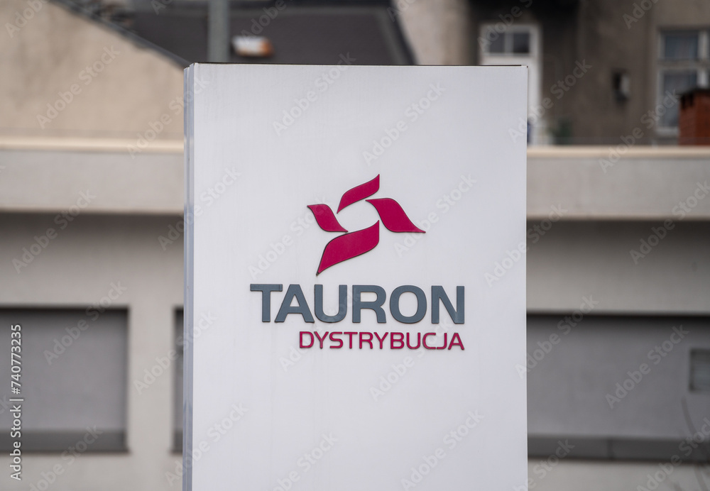 TAURON Dystrybucja logo sign outside office building in Kraków. Tauron ...