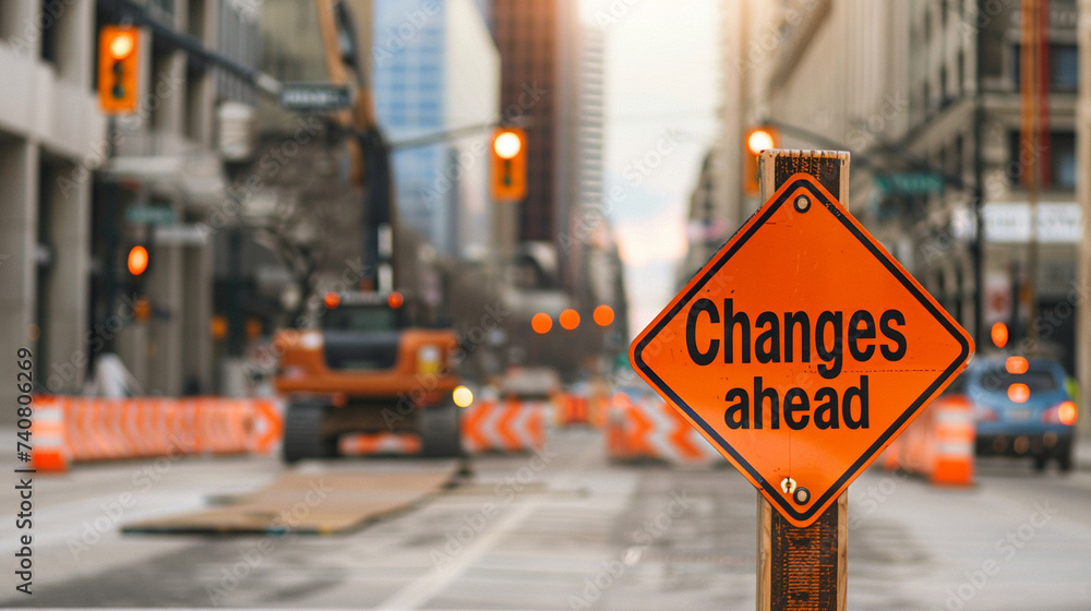 A "Changes ahead" sign on a city street being repaved or redesigned ...