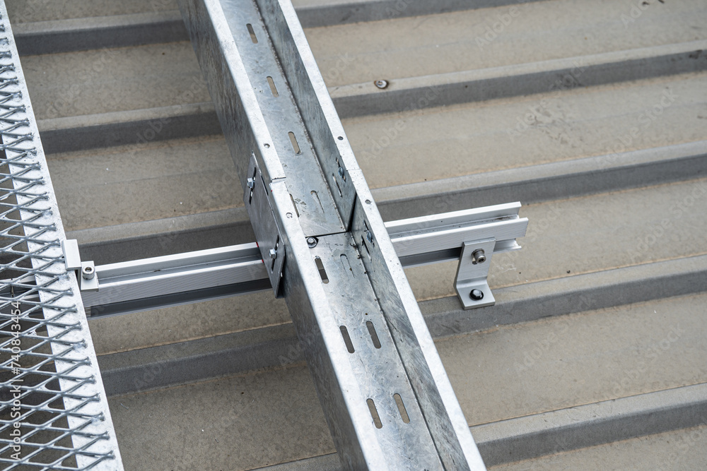 Install the solar system cable tray on the roof. Stock Photo | Adobe Stock