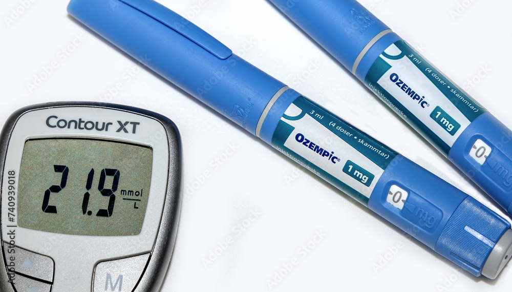 Blood sugar meter with test strips indicates high blood sugar levels ...