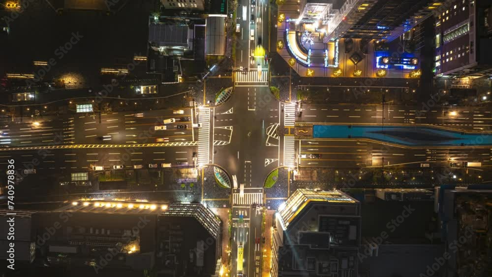 Top down ascending hyperlapse footage of traffic on road intersection ...