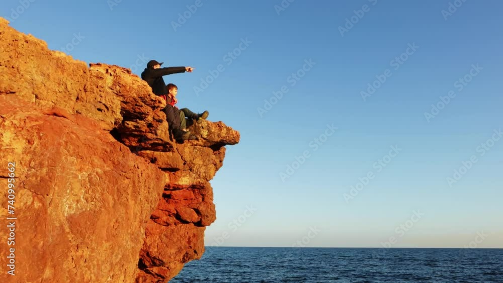 dad and son contemplate the beauty of nature. Freedom. Cinematic look ...