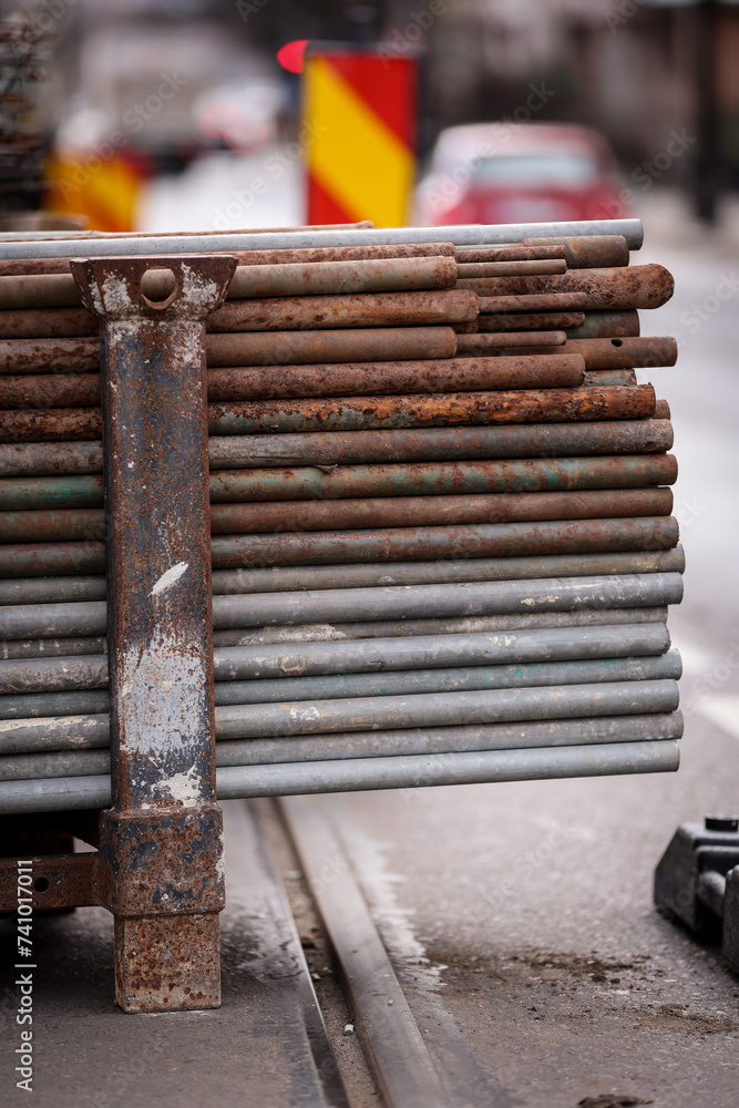 Big stack of iron bars used in road construction and tram rail ...