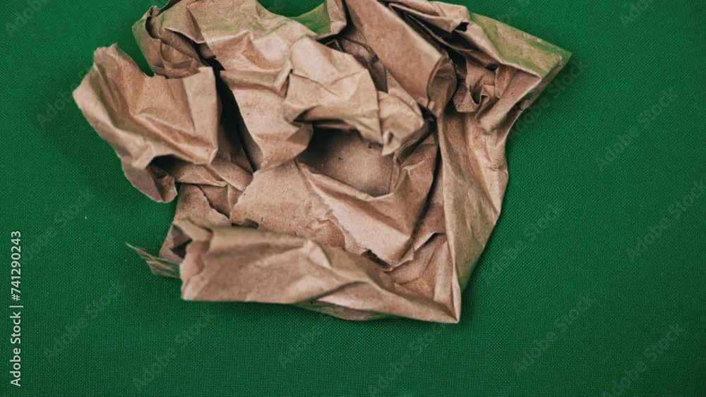 Animation of folding craft paper, freeze frame on green screen ...