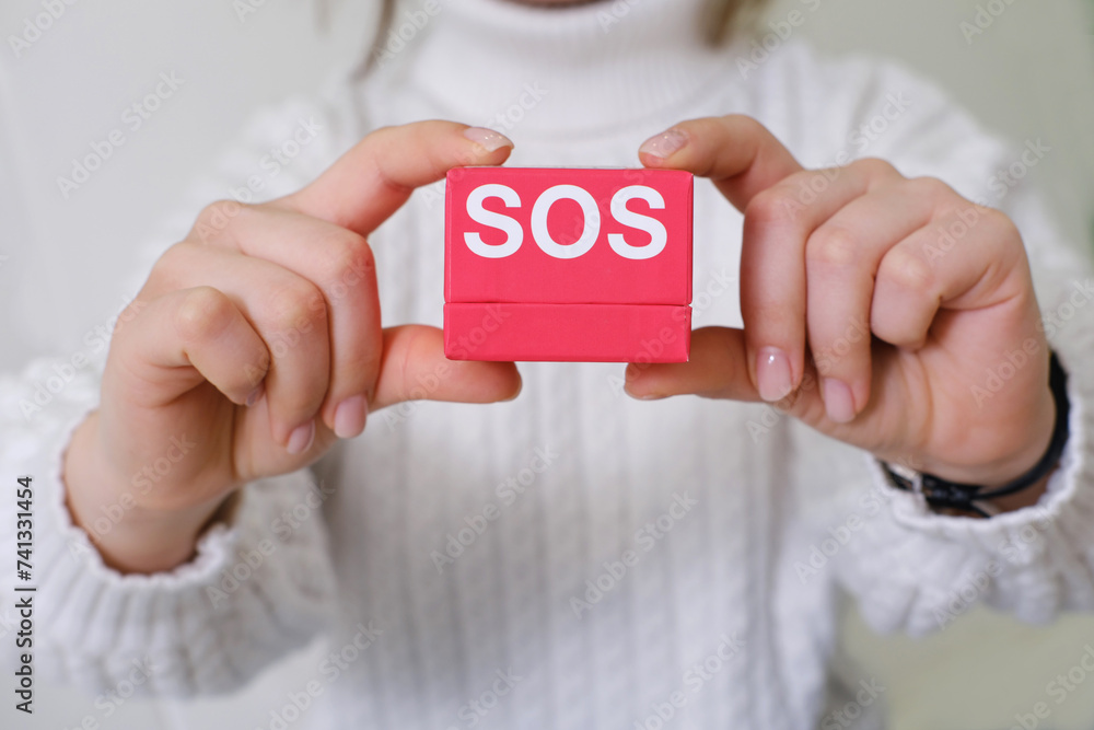 SOS Emergency Skin Care Product Presentation. Hands carefully holding a ...