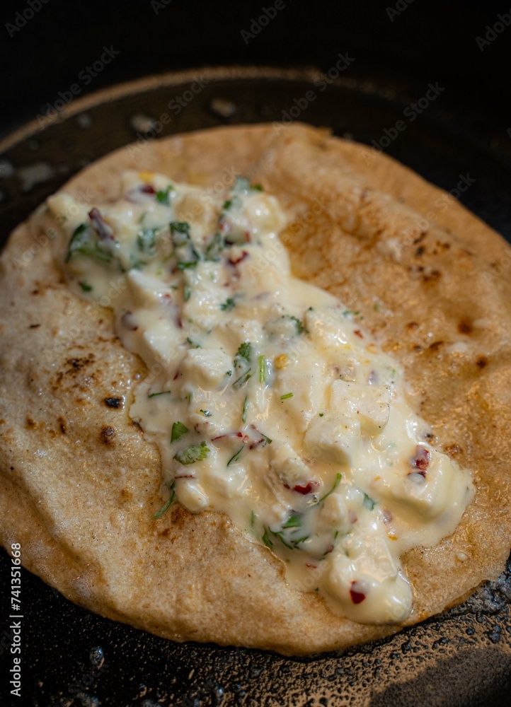 Delicious healthy vegetarian vegetable roll on a frying pan. Cheese ...