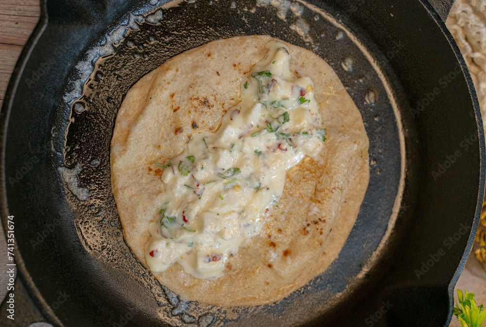 Delicious healthy vegetarian vegetable roll on a frying pan. Cheese ...