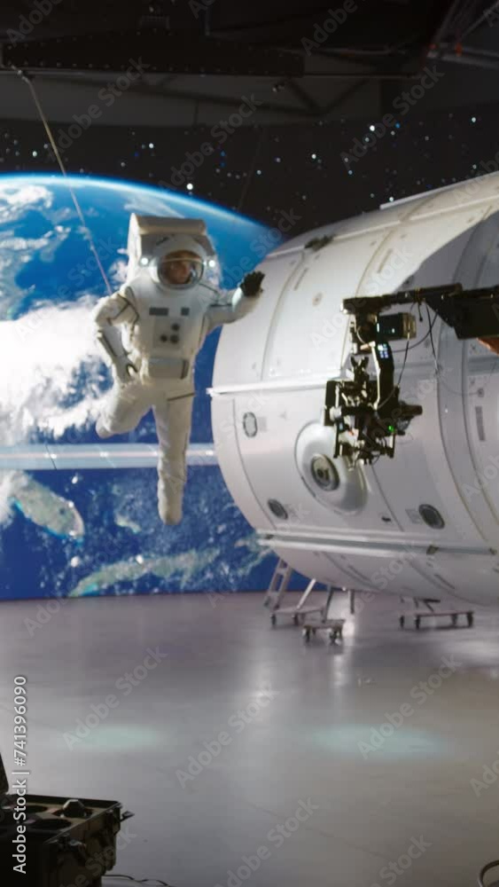 Vertical Screen: Female Directing a Movie Sequence with an Astronaut in ...