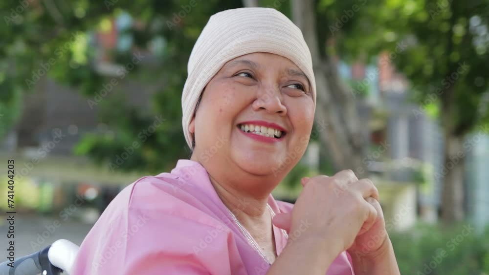 Elderly Asian woman with cancer wearing a chemo hat Smile happily, have ...