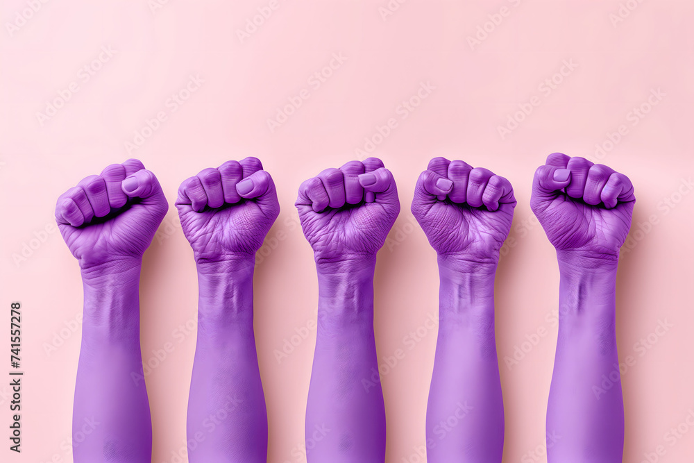 International Women's Day. Image of several purple arms raised, with ...