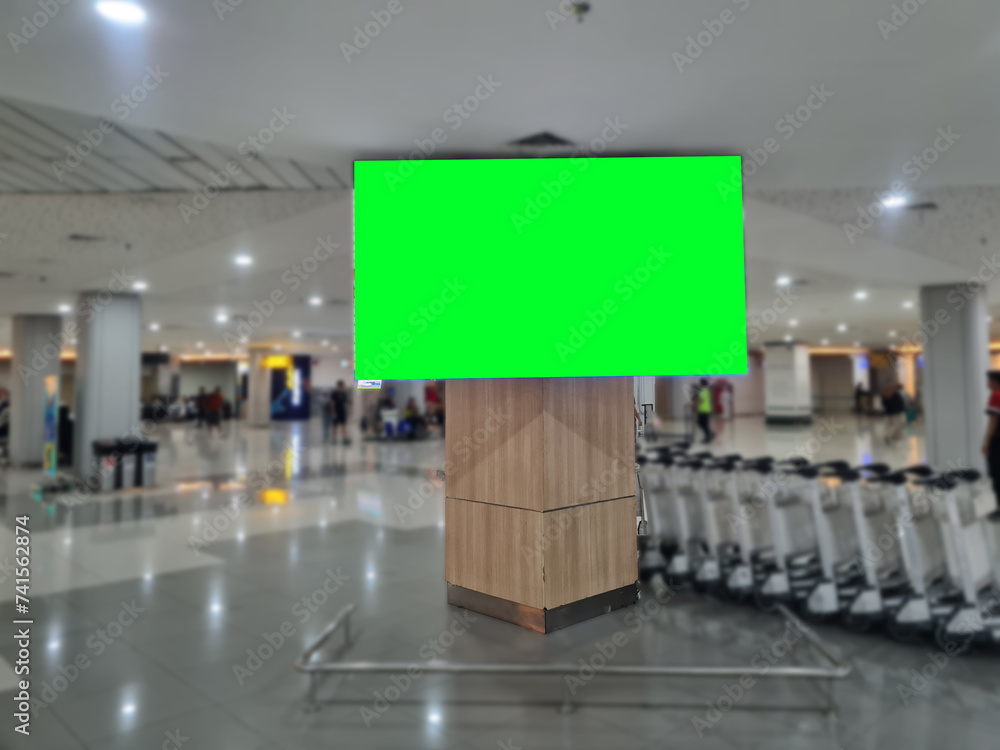 blank green LED screen on building pillar. billboards at airports or ...