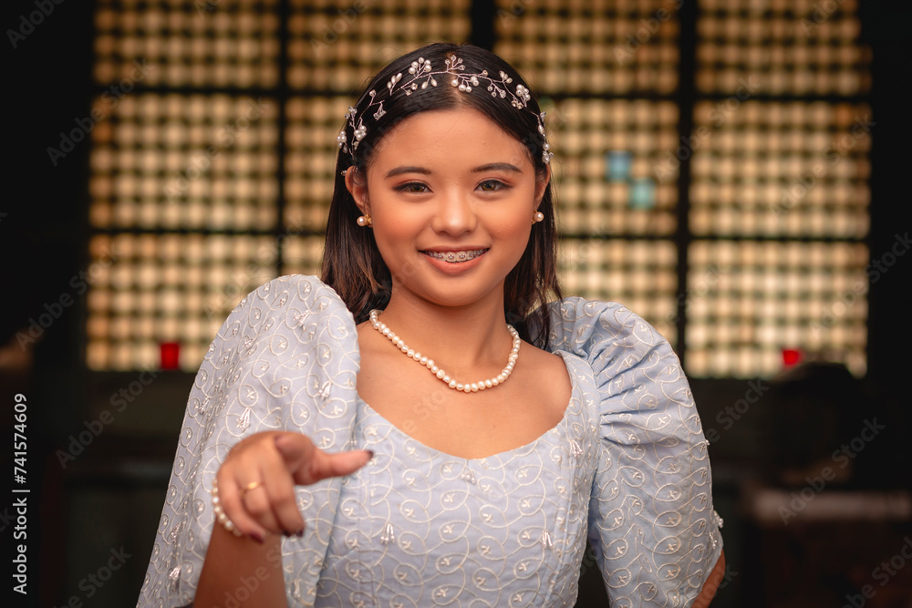 A beautiful radiant young Filipino woman in a grayish blue baro’t saya ...