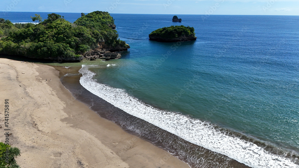 aerial view of the sea with a group of islands and clear blue water ...