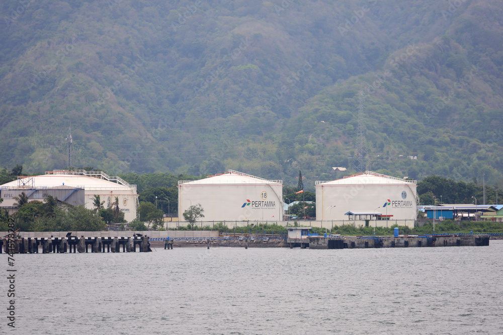vertical storage tanks, Pertamina oil refinery near the Ketapang port ...