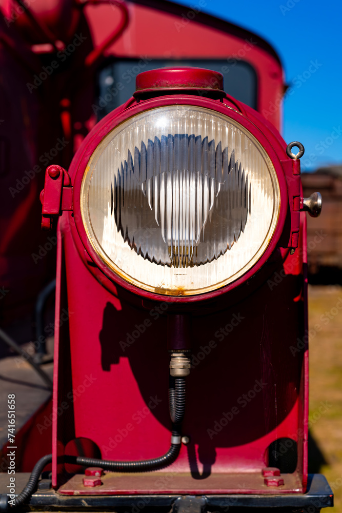 Red headlight lamp of a historic old diesel engine small shunting ...