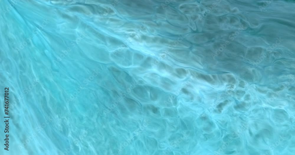 Bright glowing blue liquid energy flowing, moving, closeup. Azure ink ...
