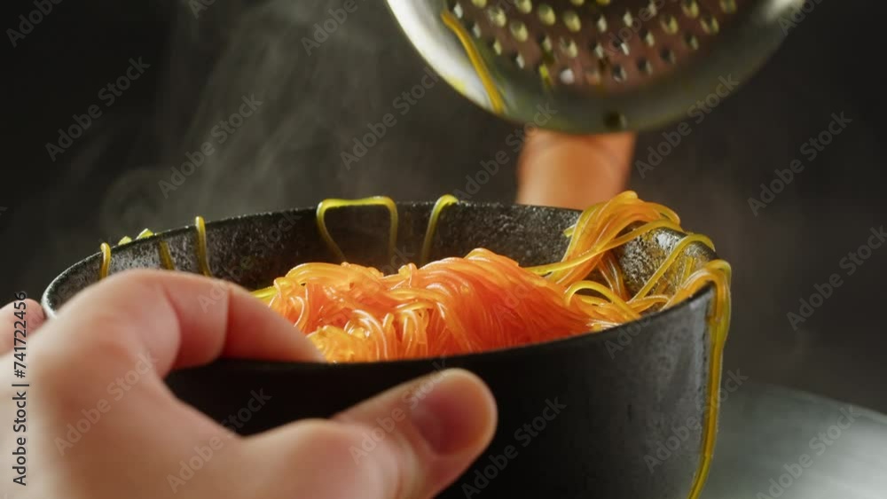 Cooking instant Funchoza noodles texture.noodles in boiling water with ...