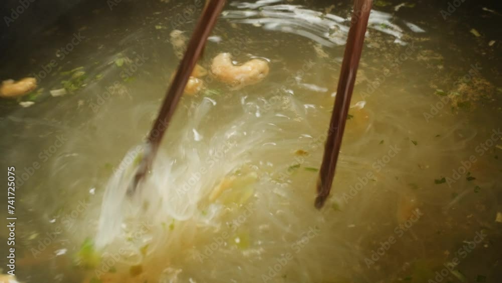Cooking instant Funchoza noodles texture.noodles in boiling water with ...
