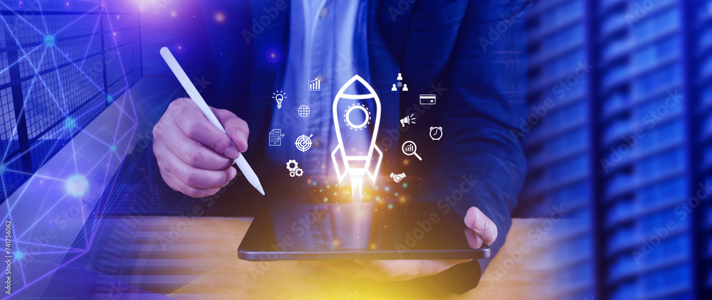 Startup business concept, rocket launching and flying from hand to sky ...