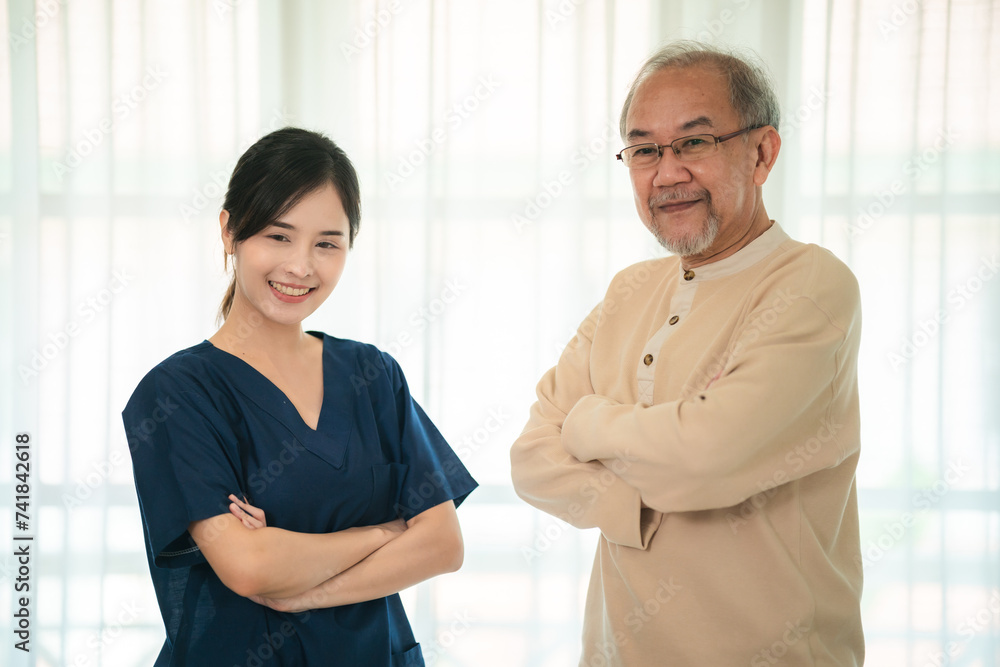 Young asian female nurse care giver helping asian senior old man in ...
