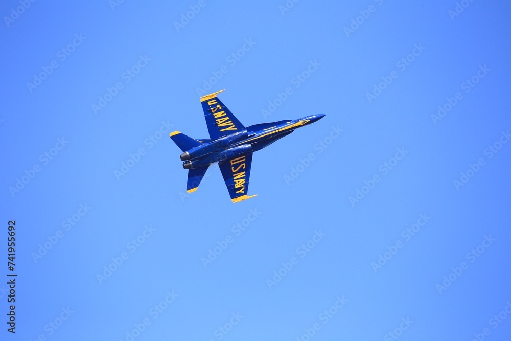 Navy's Blue Angels perform a acrobatic formation fly over during an ...