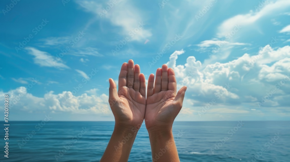 Woman hands place together like praying in front of nature ocean and ...