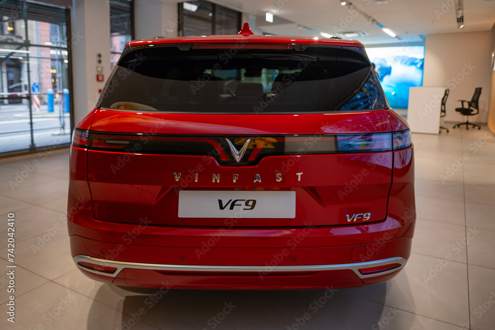 new red Vinfast vf 9 electric SUV in Studio, advanced technologies in ...