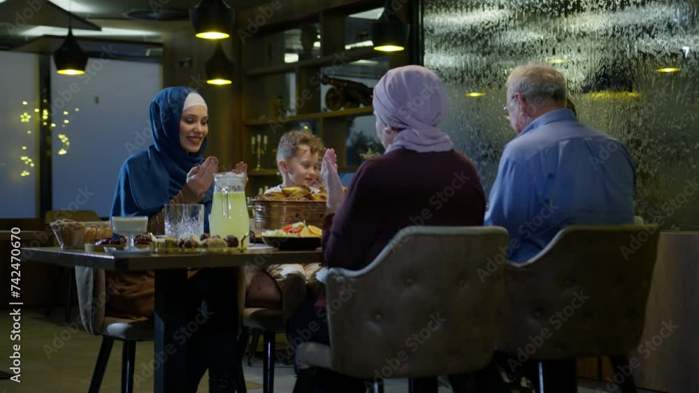 Mother in Hijab Teaching a Child How to Pray. Muslim Family Praying at ...