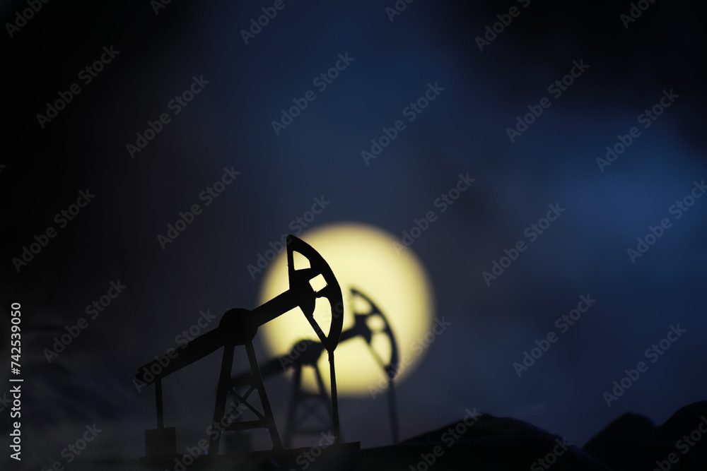 The crank balanced beam pumping unit under the curtain of night. Beam ...