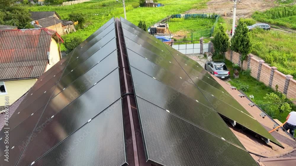 Solar photovoltaic panel system on modern house rooftop. Solar ...