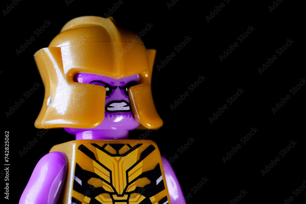 Face of LEGO Marvel's Thanos on a black background. Thanos in a yellow ...