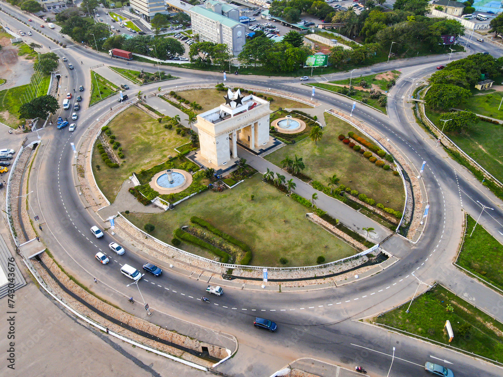 Aerial view of Independence Arch and cityscape with winding roads and ...