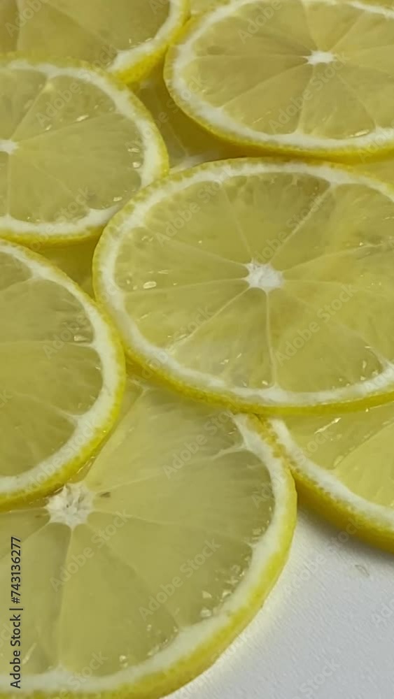 Vertical screen: Juicy Lemon Slices, Macro. Sliced Lemon Pieces Rotate ...