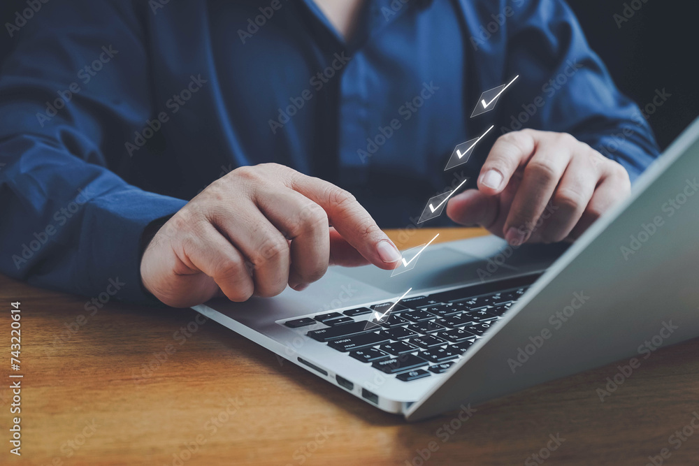 Checklist, businessman checking mark on checklist with marker ...