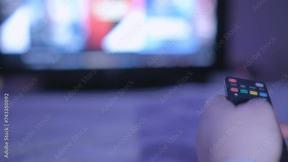 4K men hand holding the TV remote control and turn off smart tv ...