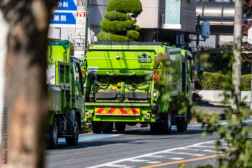 Tokyo, Japan, 3 November 2023: Green Garbage Truck on Tokyo Streets ...
