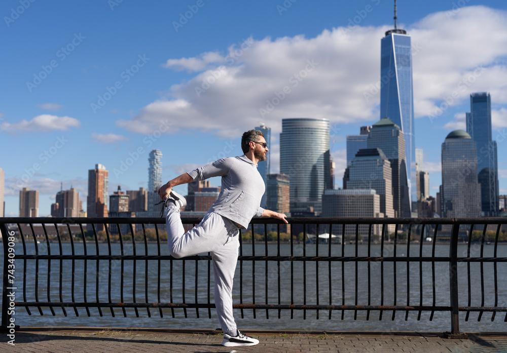 Athlete stretching muscles after running. Athlete stretching to improve ...