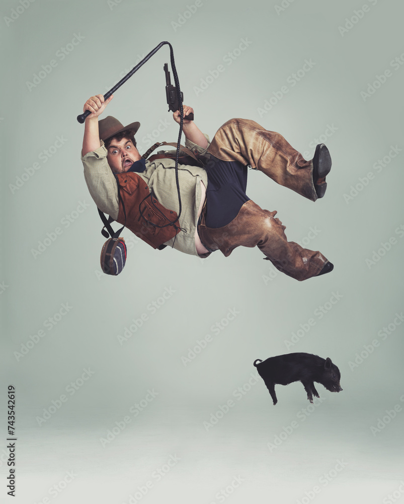 Cowboy, accident and man catching pig for texas culture in studio on ...