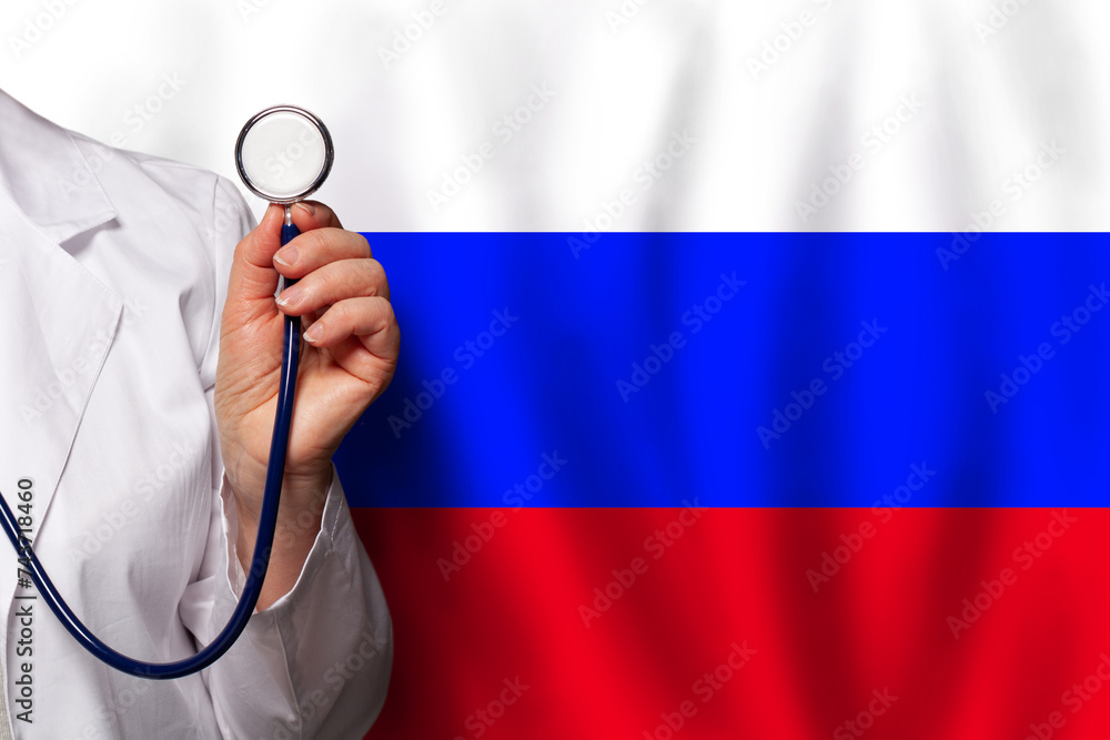 Russian doctor's hand with stethoscope on the background of flag of ...