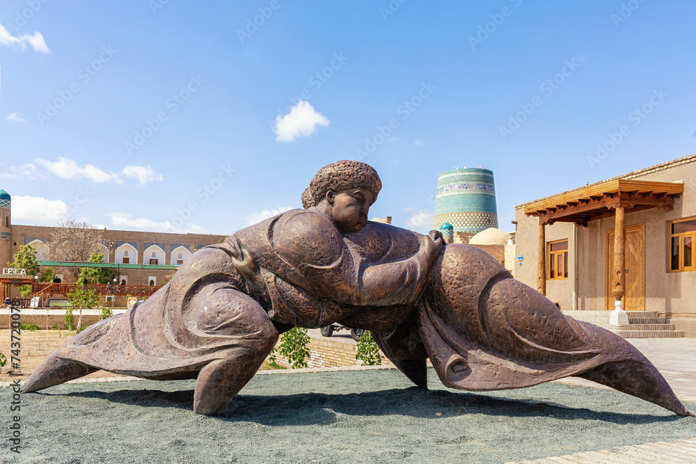 Kurash wrestlers. Modern sculpture at the square of Ichan-kala, old ...