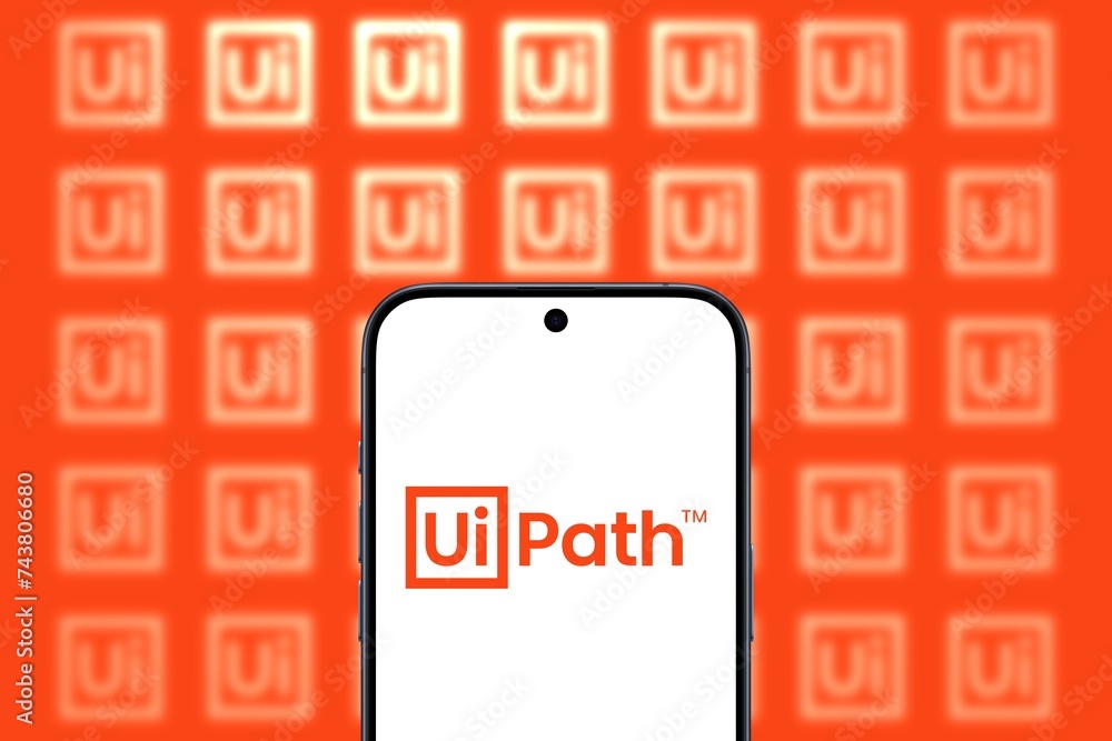 UiPath Logo is displayed on a modern smartphone, global software ...