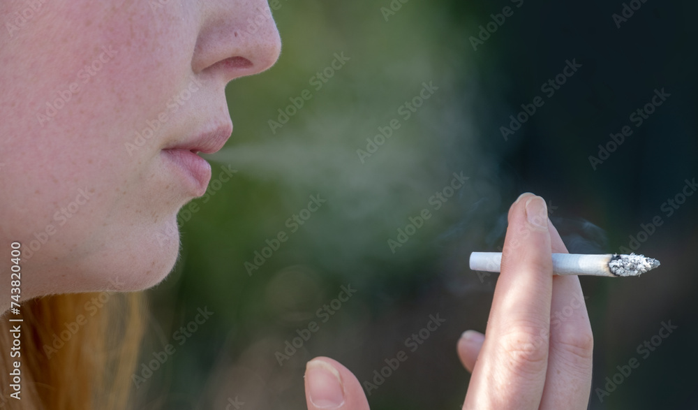 Portrait, hand, mouth and hand drawn and hand-rolled Cigarette of a ...