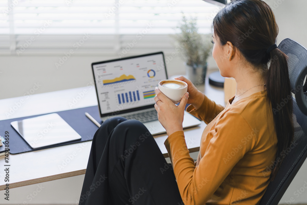 Female advisor financial business analytics using data dashboard graphs ...