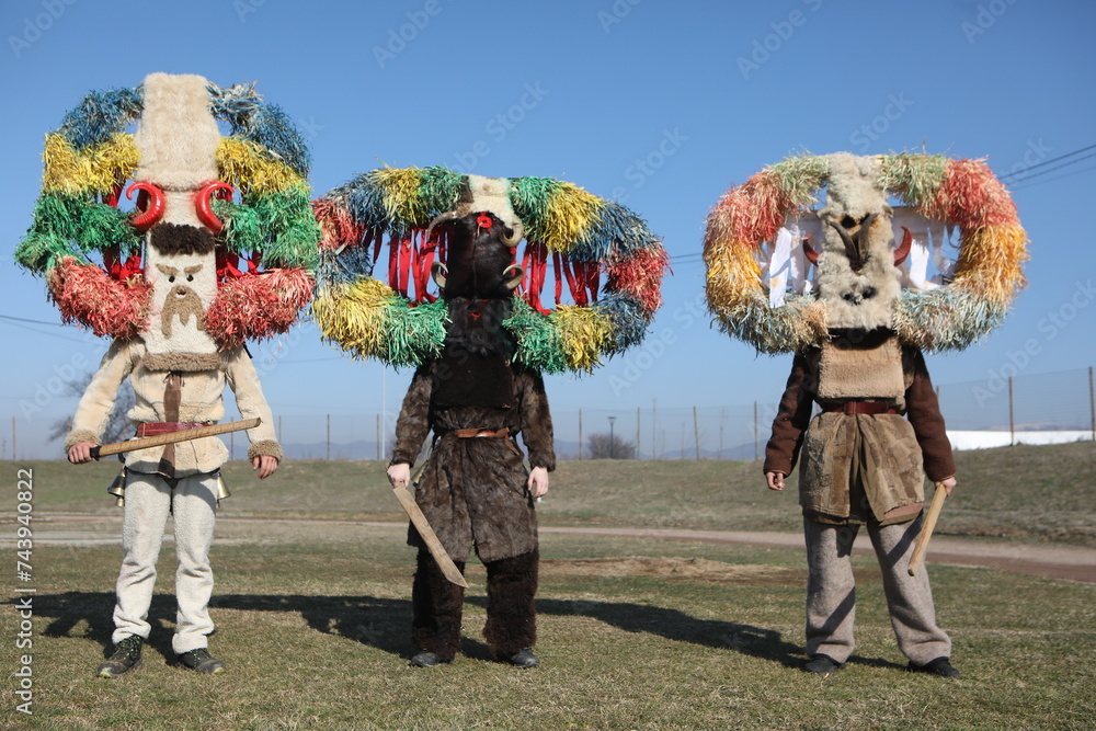 People called Kukeri parade in masks and ritual costumes, perform ...